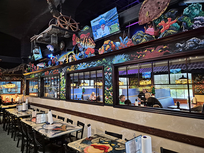 The nautical-themed dividers aren't just decorative&mdash;they're portals to different oceanic worlds within this seafood sanctuary.