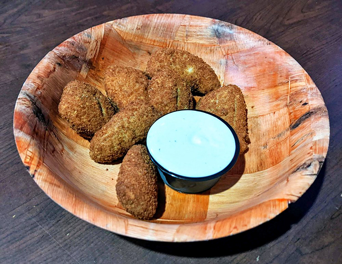 These aren't just jalapeño poppers—they're little golden grenades of cheese and spice, waiting to ambush your taste buds with joy.