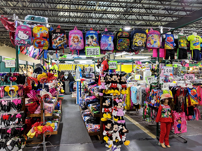 Disney characters stand guard over a kingdom of kid-friendly merchandise. Mickey seems to say, "Buy me, and the magic of Florida goes home with you!"