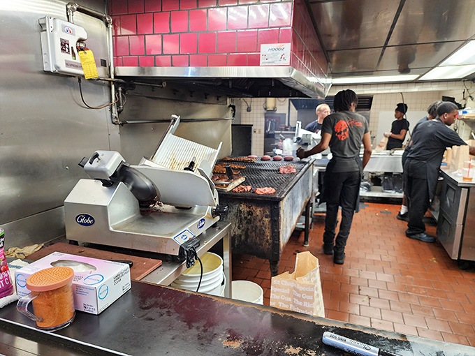 The kitchen—where the magic happens. That open flame isn't just cooking meat; it's creating memories and curing Monday blues one sandwich at a time.