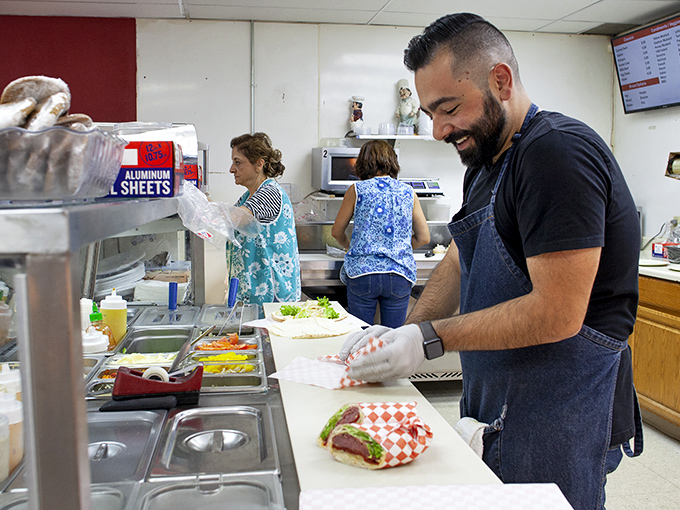 Where the magic happens. The sandwich assembly line at Express Deli operates with the precision of a Swiss watch and the soul of a jazz quartet.