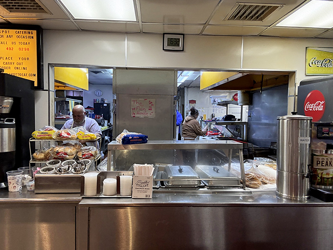 Behind the scenes, the kitchen hums with practiced efficiency&mdash;the beating heart that keeps The Spot's culinary traditions alive.