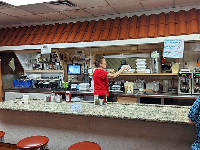 Behind the granite counter, the kitchen crew orchestrates the breakfast symphony that keeps Tampa coming back for encores. 
