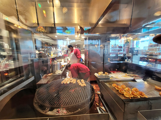 Where the magic happens&mdash;mesquite grills firing away as cooks orchestrate your seafood feast behind glass, like a delicious aquarium in reverse.