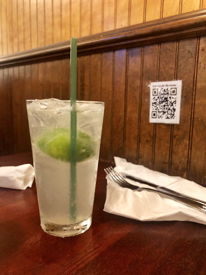 This isn't just a limeade &ndash; it's summer in a glass, sitting pretty against the restaurant's classic wood paneling. Refreshment: unlocked.