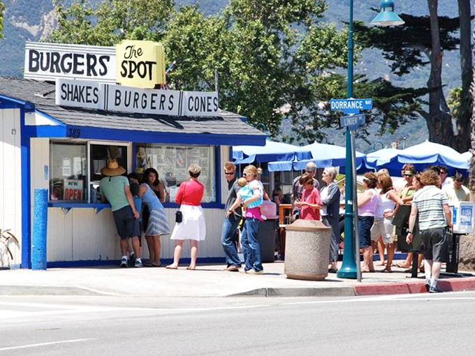 The line forms with the patience of pilgrims, each person knowing that transcendent burger experiences are worth every minute of the wait.