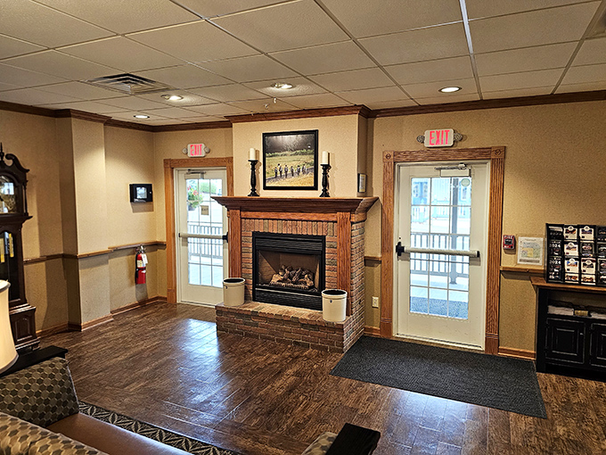 The cozy entrance with its brick fireplace doesn't just welcome you &ndash; it practically wraps you in a warm hug before you've even ordered.