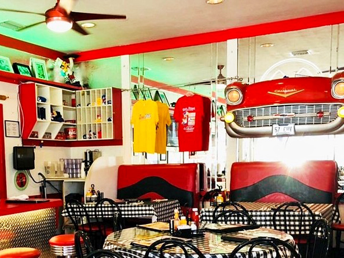 The front-end of a classic Chevy serves as d&eacute;cor while t-shirts hang like trophies&mdash;American nostalgia you can eat with your eyes.