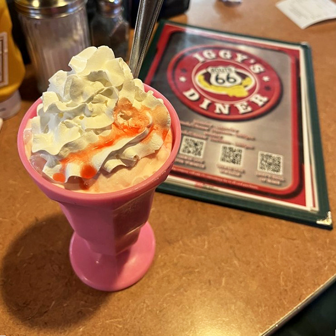 This milkshake isn't just thick&mdash;it's contemplating a run for political office. Served in a classic pink glass with whipped cream that defies gravity.