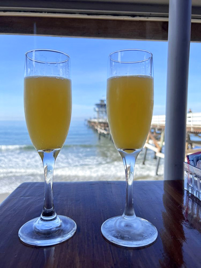 Mimosas with a view that makes every sip taste like celebration. Nothing says "life is good" quite like bubbles and ocean waves.