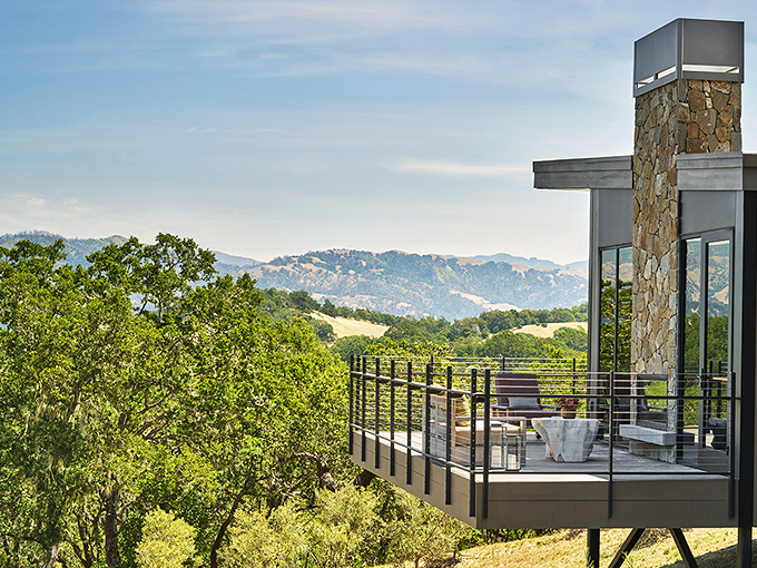 This modern deck perched above rolling hills offers the kind of view that makes you forget to check your phone for days.