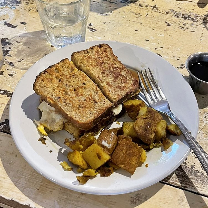 Breakfast meets lunch meets your new obsession&mdash;golden-toasted bread hiding savory treasures and those perfectly seasoned potatoes playing the perfect supporting role.