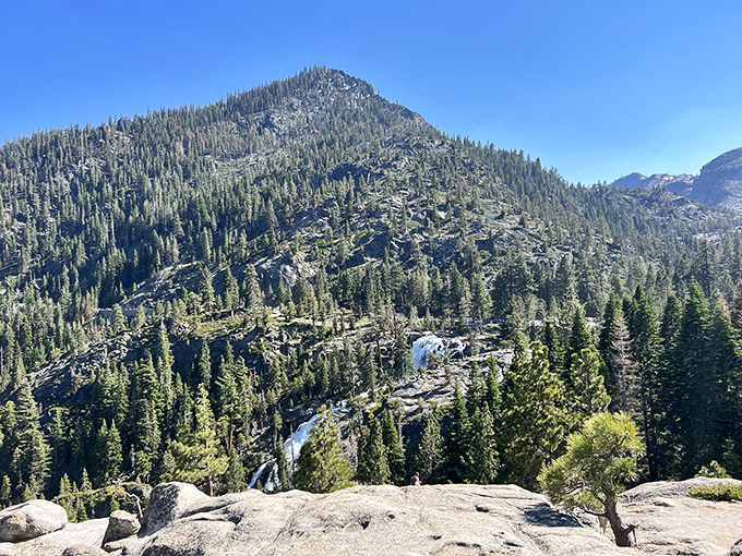 The Sierra Nevada mountains stand like ancient guardians, watching over Vikingsholm just as they did when the first stone was laid.