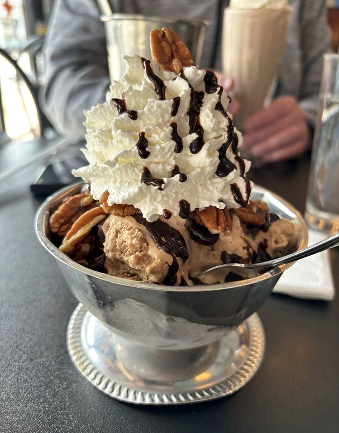 Ice cream elevated to architectural wonder. This sundae doesn't just satisfy cravings&mdash;it creates memories topped with whipped cream mountains and chocolate rivers.