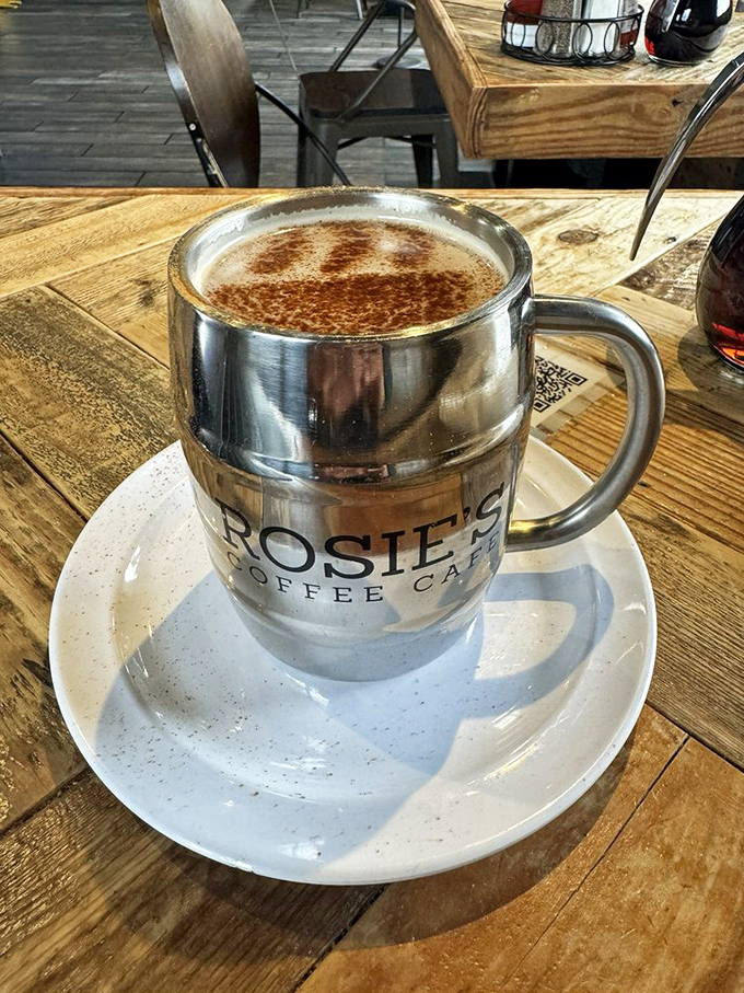 Coffee served in a barrel mug with the Rosie's logo—because sometimes your caffeine needs its own fortress of solitude.