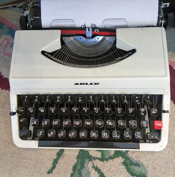 An Adler typewriter waiting for its second act&mdash;perhaps as the start of your novel or just the coolest Zoom call background ever.