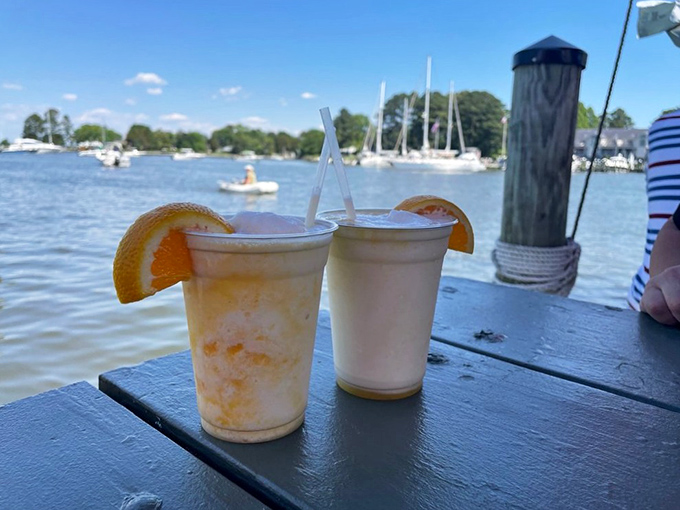 Orange Crushes on the deck—where vitamin C meets vitamin "sea." These aren't just drinks; they're liquid sunshine with a view.