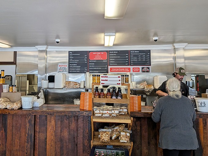 The altar where barbecue prayers are answered daily. That wooden counter has seen more genuine smiles than a lottery winner's convention.