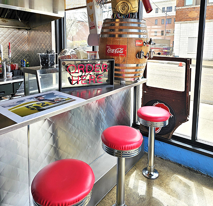 The classic diner counter with red stools invites you to belly up for conversation and cuisine.
