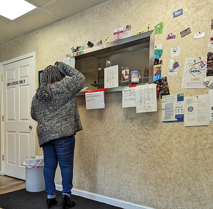 The ordering counter – where dreams are spoken aloud and transformed into cardboard containers of joy.