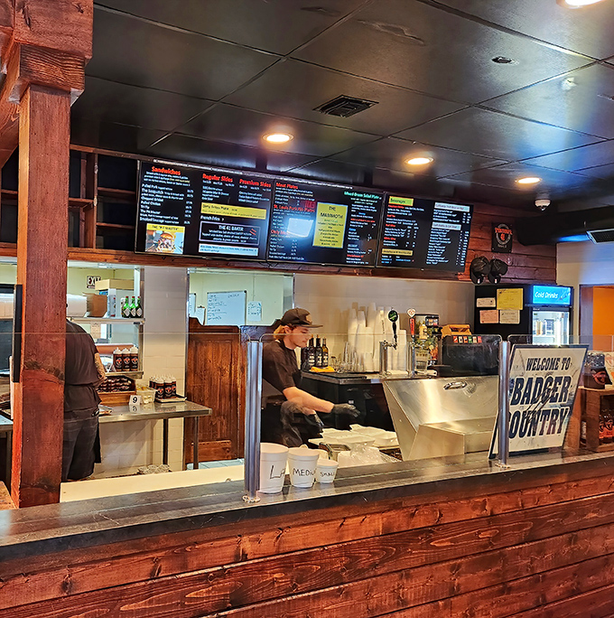 The "Order Here" neon beckons like a smoky beacon of hope for hungry barbecue pilgrims. 