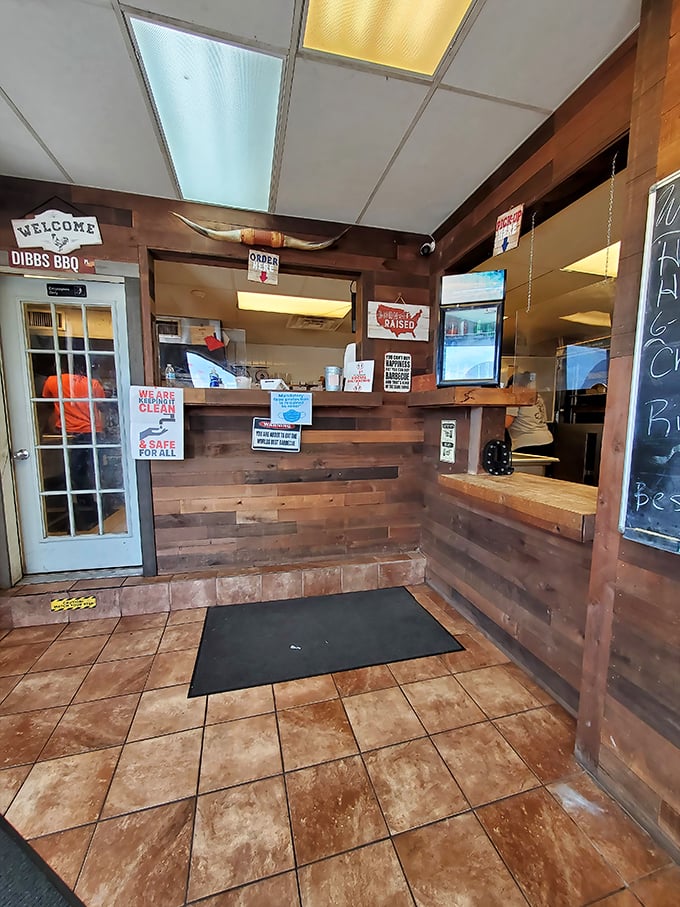 The ordering counter where barbecue dreams come true, complete with a "Welcome" sign that might as well say "Prepare for Deliciousness."