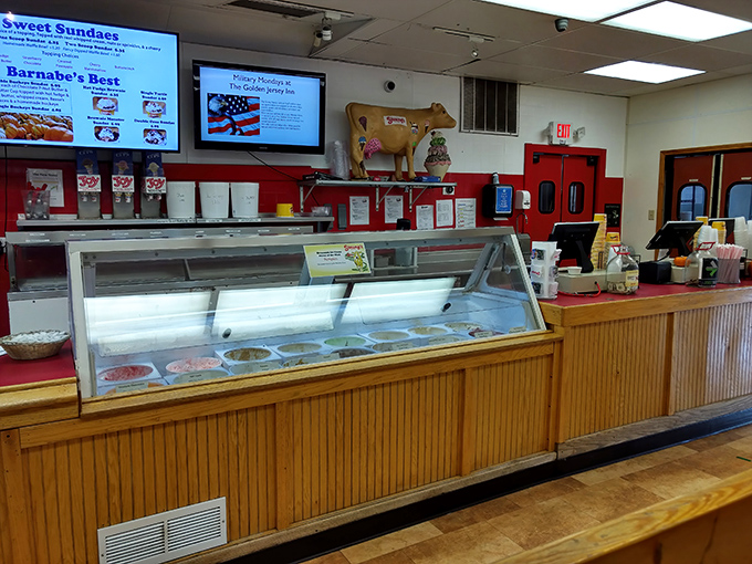 The ice cream counter—where dreams come true and diets go to die. That golden cow watching over the proceedings knows what's up.
