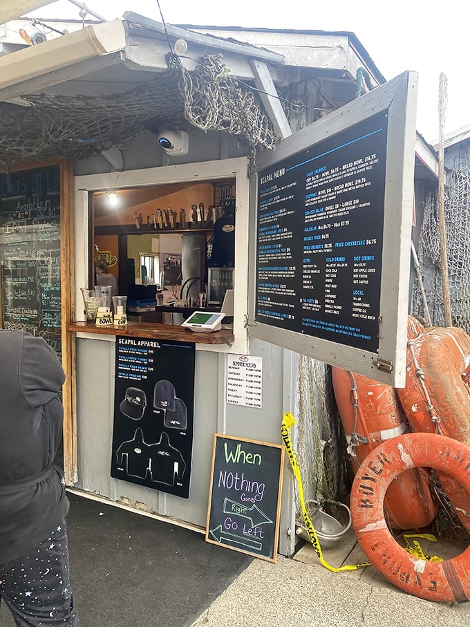 Maritime meets menu at this nautical order window. The fishing net overhead isn't decoration—it's catching dreams of the perfect meal.
