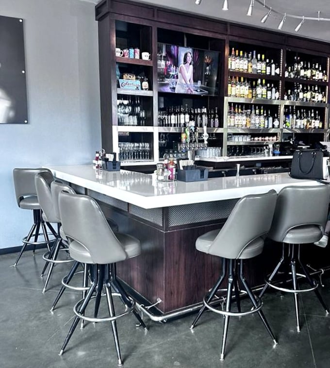 A bar setup that would make even non-morning people reconsider their stance on early rising. Enough bottles to cure whatever ailed you last night.