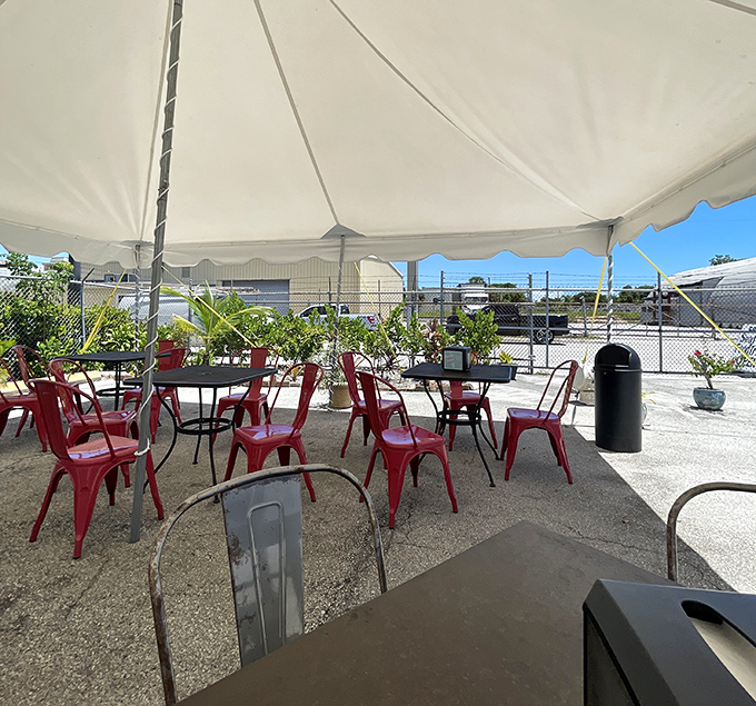 Red chairs, white tent, blue skies—an all-American setting for enjoying treasures from Florida waters. Simplicity at its finest.