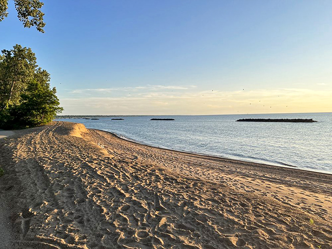 Miles of pristine shoreline stretch endlessly, proving that Great Lakes beaches can rival any coastal paradise.