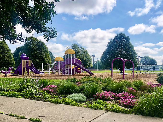 Arcola's playground bursts with color against the summer sky, proving small towns know that investing in places for children to play is investing in their future.