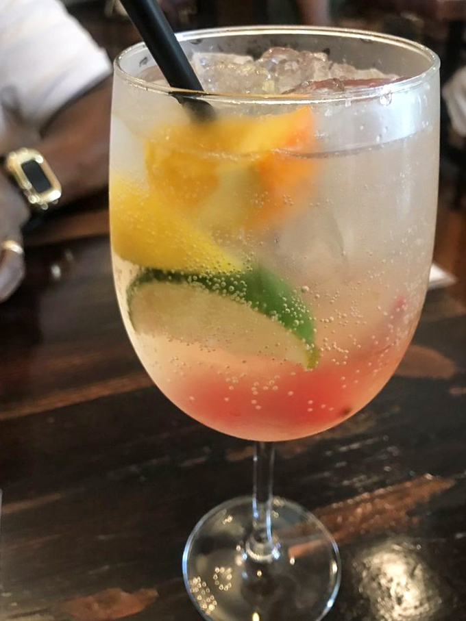 This isn't just a drink, it's a sunset in a glass. Peach sangria with vibrant citrus notes makes even a Monday feel like vacation.