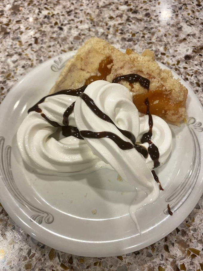 Not just pie &ndash; a cloud of whipped cream atop warm fruit filling that makes you understand why "pie in the sky" is the ultimate reward.