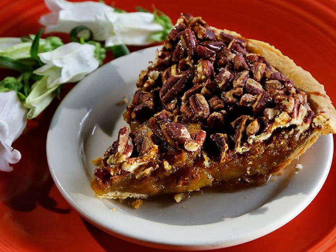 Pecan pie that's worth every calorie, with nuts arranged so perfectly they look like they're posing for their yearbook photo.