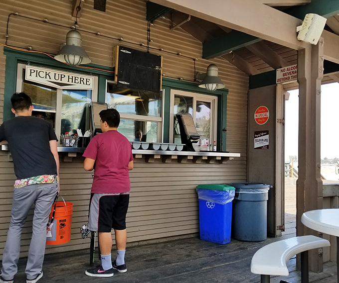 The pickup window: That magical portal where your name is called and taco dreams become delicious reality.