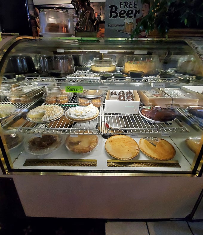 A dessert case that tests your willpower with every glance. That "Free Beer Tomorrow" sign has been lying for decades.