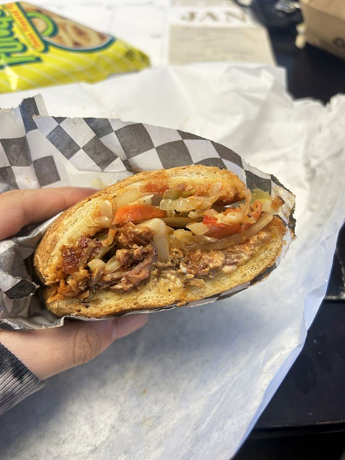 Pulled pork and caramelized onions create a sweet-savory symphony that makes you question why you've ever eaten anything else between bread.