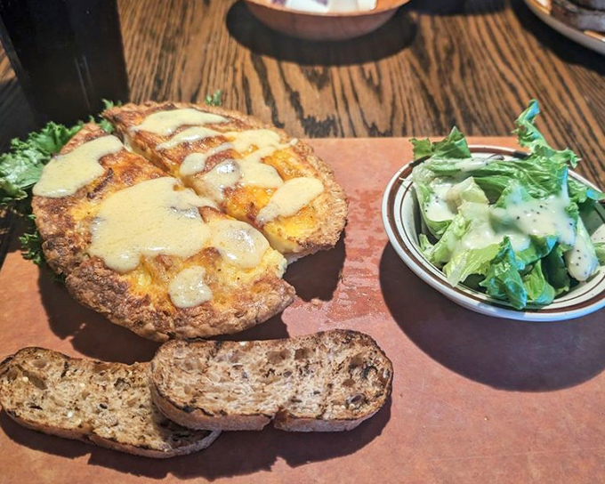 Quiche that deserves its own fan club. Golden, puffy, and served with a side of "why don't I eat this every morning?"