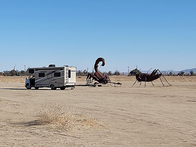 Size matters! This RV looks positively miniature next to the towering scorpion and ant sculptures that dominate this otherworldly desert landscape.