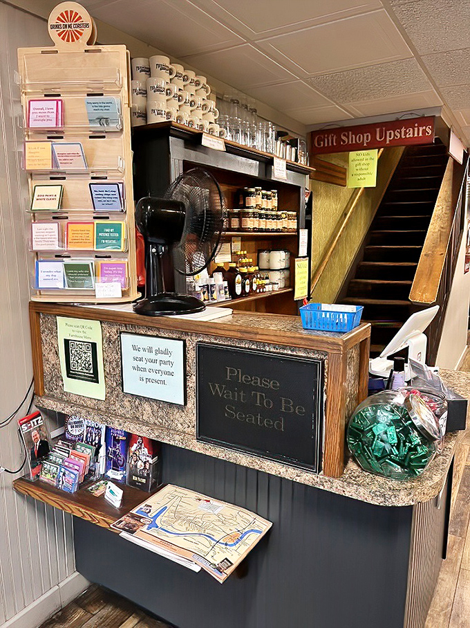 The humble reception area, where the "Please Wait To Be Seated" sign might be the hardest instruction to follow once you smell the kitchen.