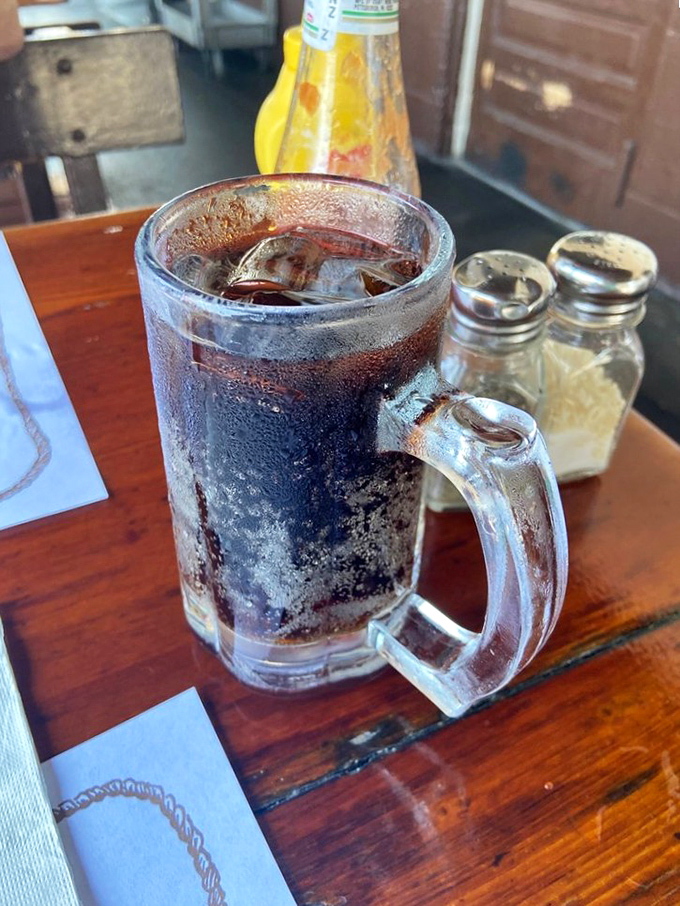 An ice-cold root beer in a frosty mug &ndash; sometimes the simplest pleasures pair perfectly with complex smoky flavors.