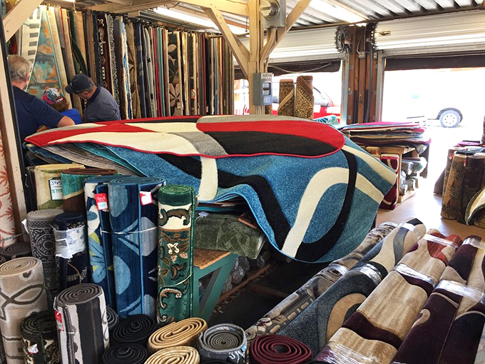 Rug merchants displaying their wares like textile art galleries. That blue swirl pattern would tie any Florida living room together nicely.