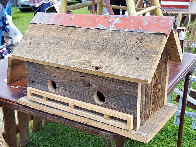 Home tweet home! This handcrafted birdhouse made from reclaimed barn wood offers feathered friends rustic accommodations with vintage charm.