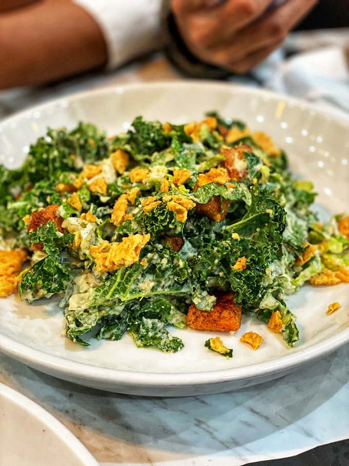 A kale salad that actually excites&mdash;crisp greens, golden croutons, and a dressing that transforms "eating healthy" from punishment to pleasure.
