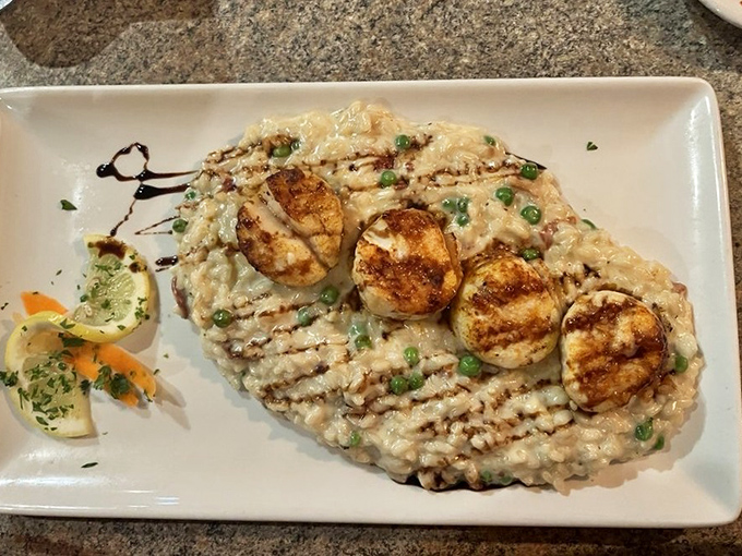 These scallops lounging on creamy risotto are having a better day than most of us. The balsamic drizzle adds just the right amount of sass.