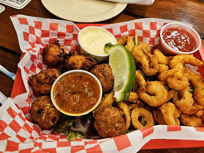 The seafood sampler that settles all arguments&mdash;fritters, calamari, and shrimp sharing a basket in perfect harmony with dipping sauces playing referee.