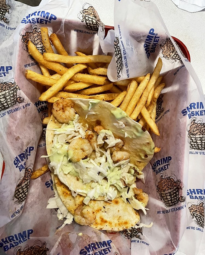 A shrimp taco that understands balance &ndash; warm tortilla, crisp lettuce, perfectly cooked shrimp, and fries that refuse to be mere sidekicks.
