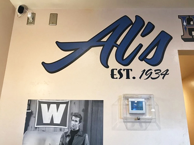 That blue neon "EAT" sign isn't just advertising&mdash;it's a one-word poem about life's simplest and most satisfying pleasure.