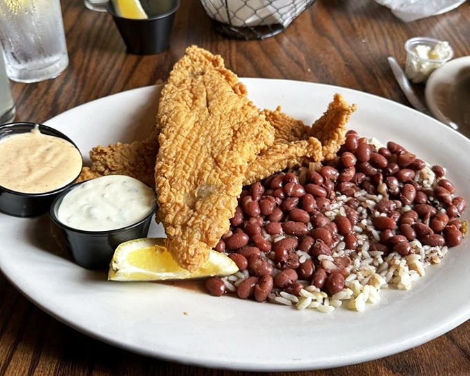 Southern fried catfish so perfectly golden it practically glows, paired with classic red beans and rice. Soul food that speaks volumes.